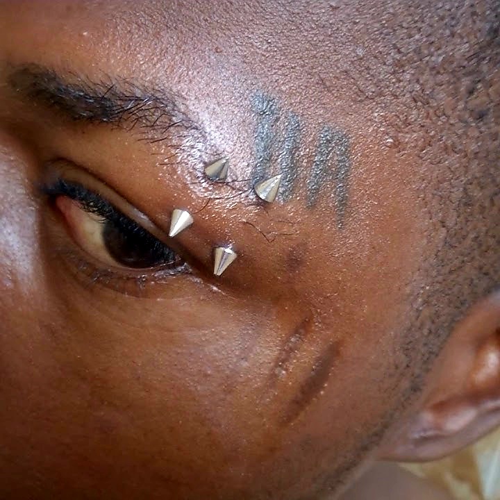 ALi Boubacar double eyebrow piercing