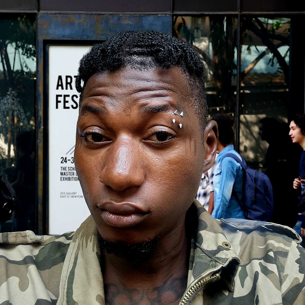 Ali Boubacar has double eyebrow piercings, one on ea...