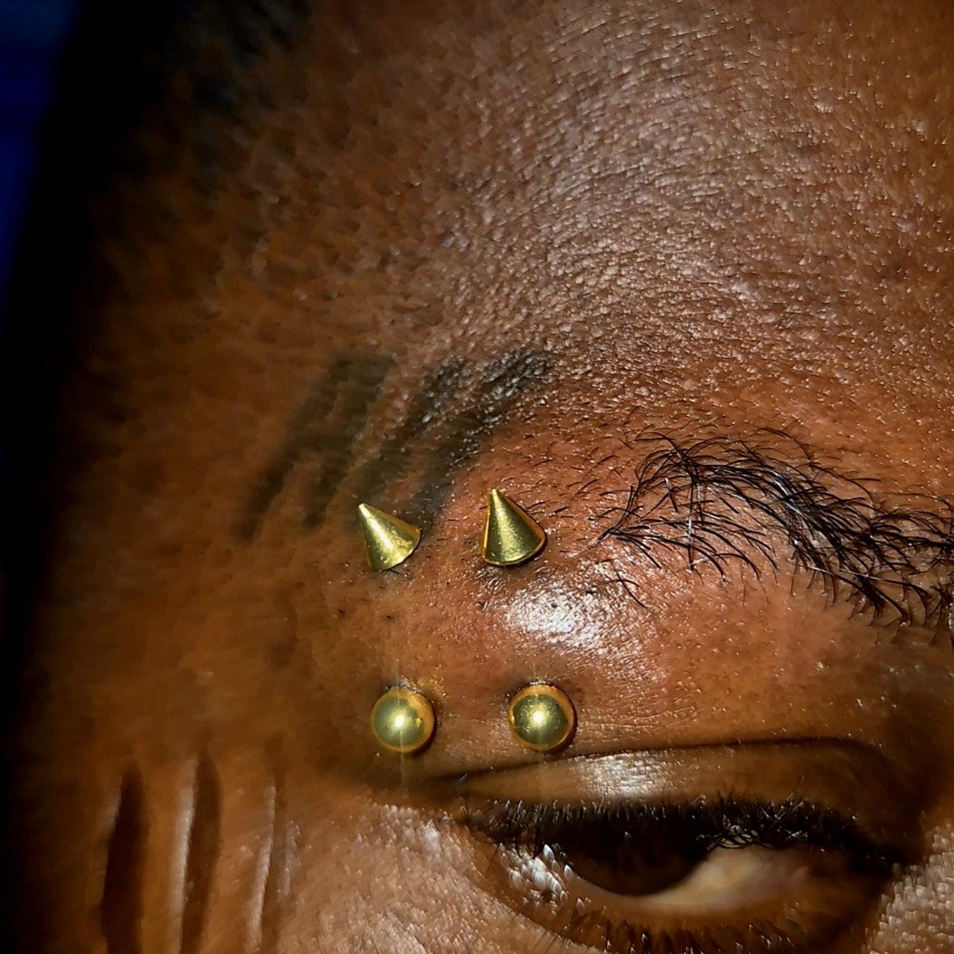 ALi Boubacar double eyebrow piercing jewelry gold St...