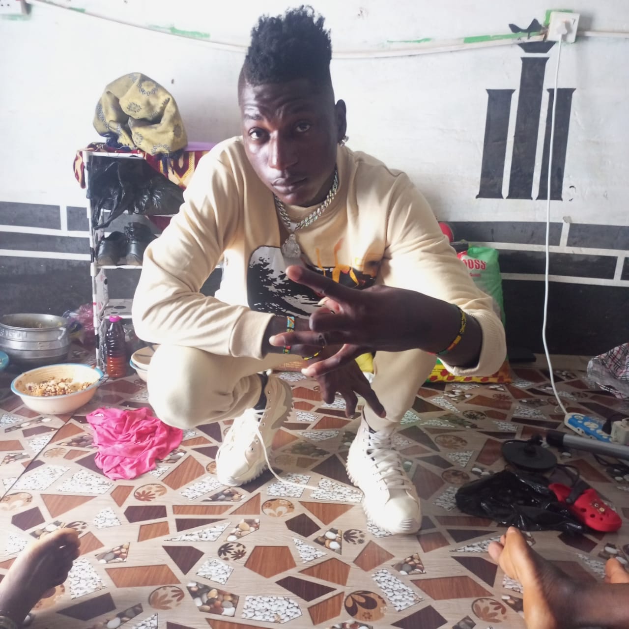 ALi Boubacar dons head to toe white attire after lea...