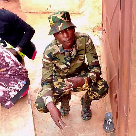 ALi Boubacar is dressed in a soldier's outfit.