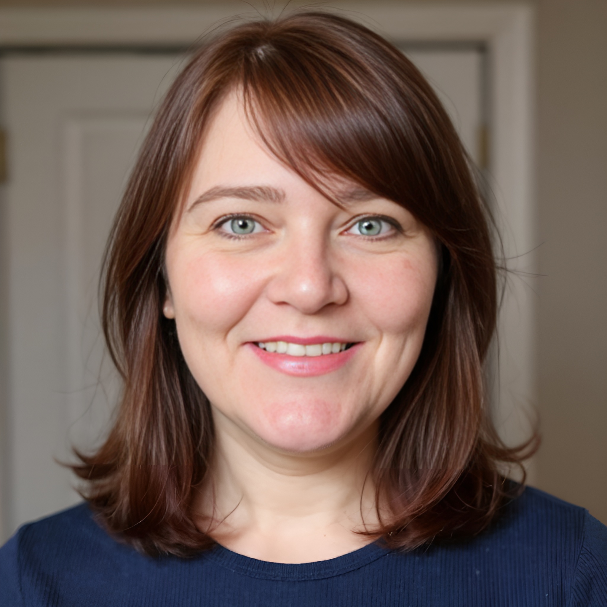 A naturally beautiful woman in her 40s with soft, fa...