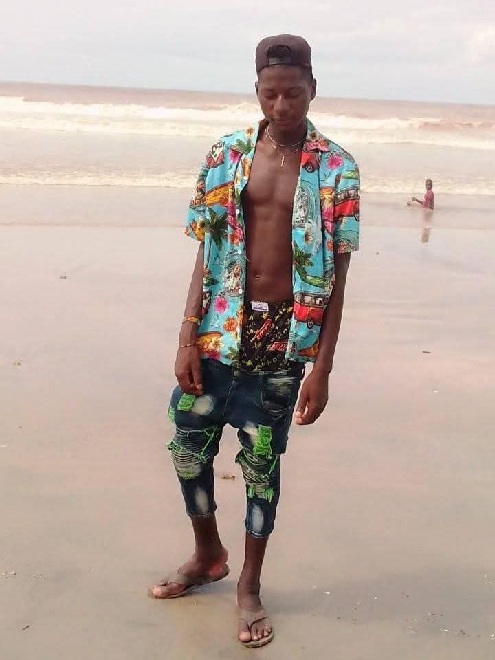 Ali Boubacar basked in the sun's warmth on the beach